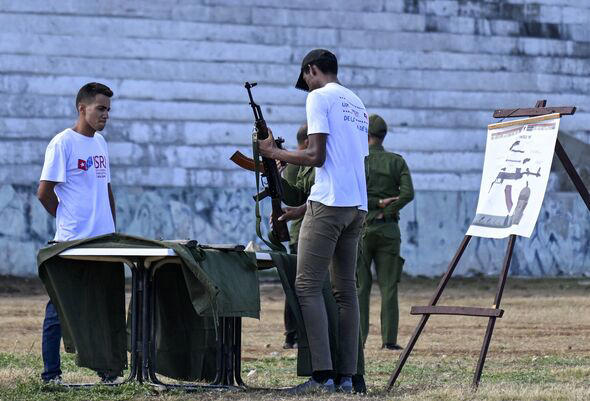 Cuba hands out weapons to citizens and tells them 'prepare for an invasion'