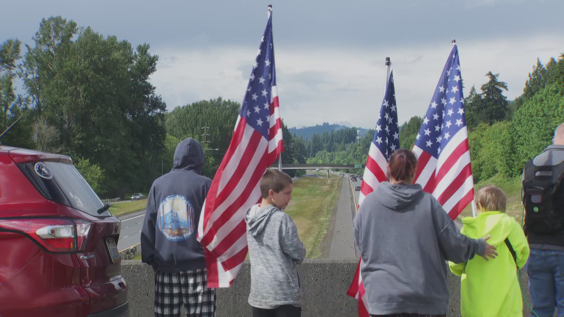 Residents mourn Longview victims as procession delivers their bodies home