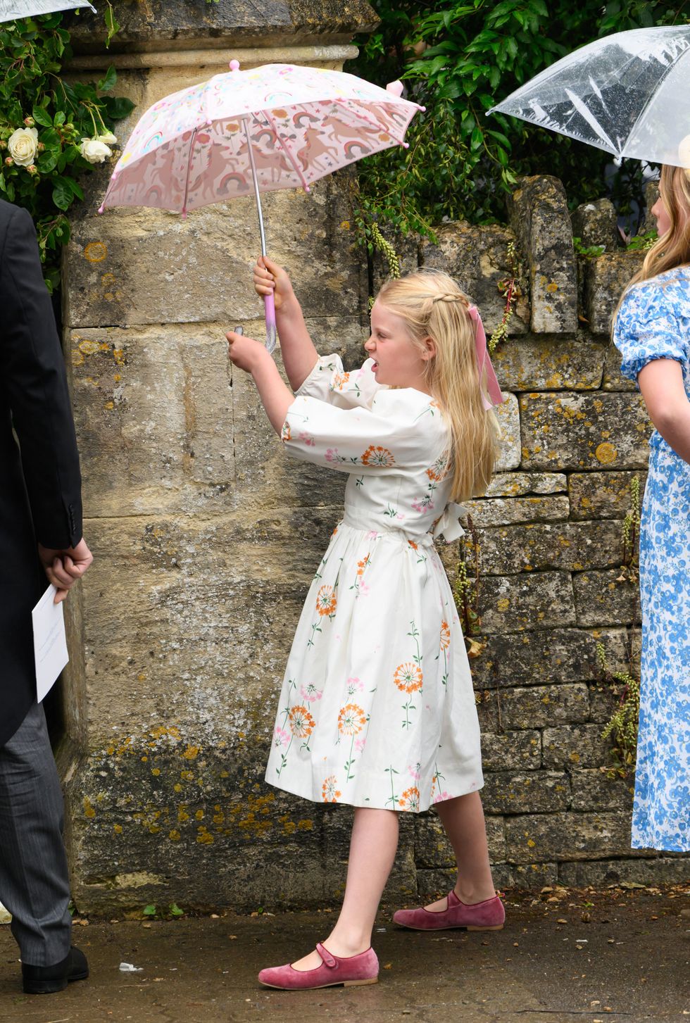 Mia and Lena Tindall steal show at royal wedding as pair shield from ...