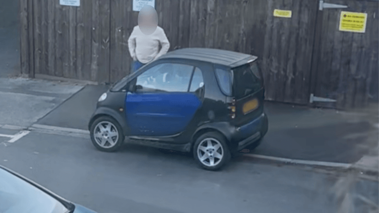 Neighbour from hell tries to storm into next door house shouting 'fight ...