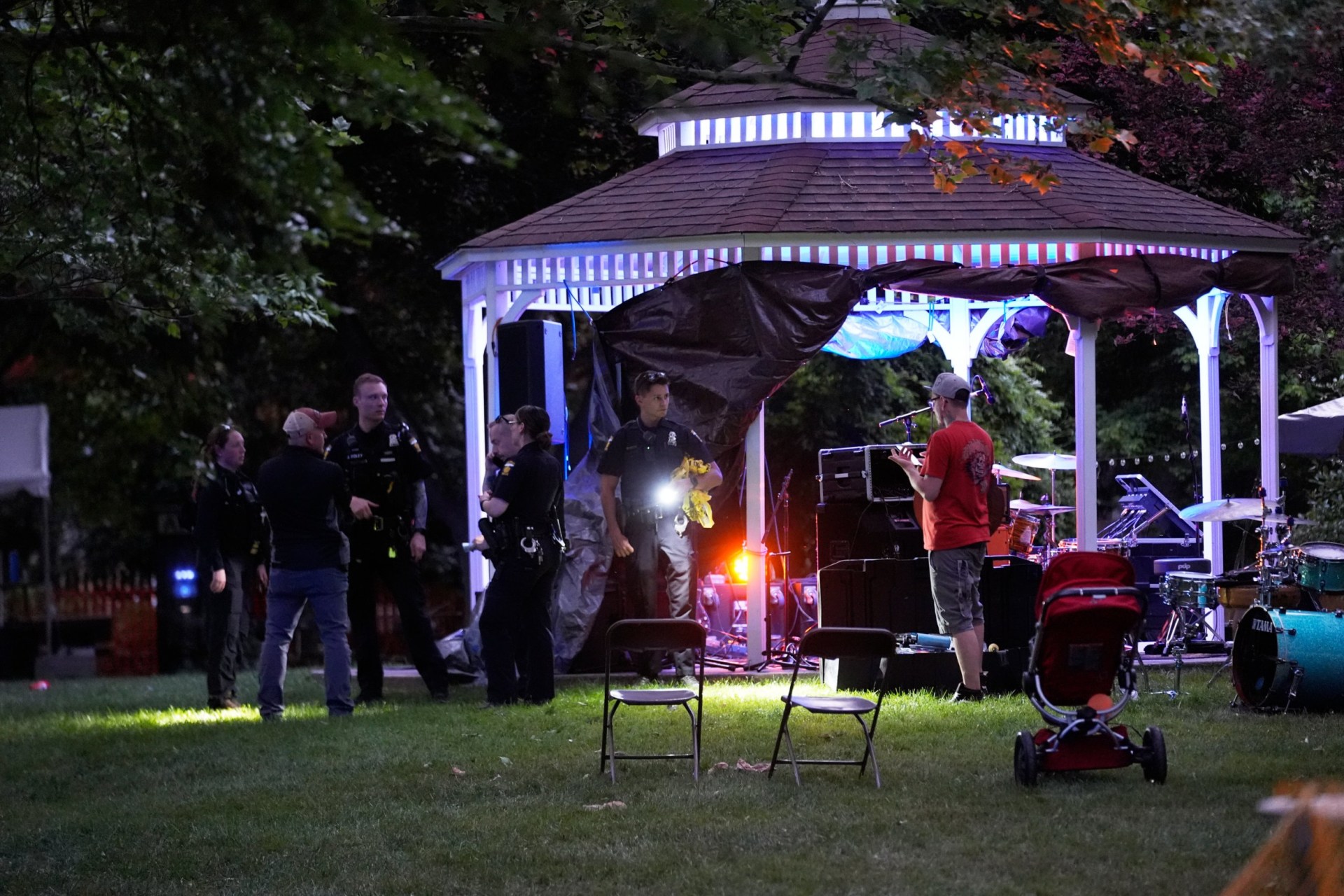 Police hunt for gunmen after 12 people shot at community festival