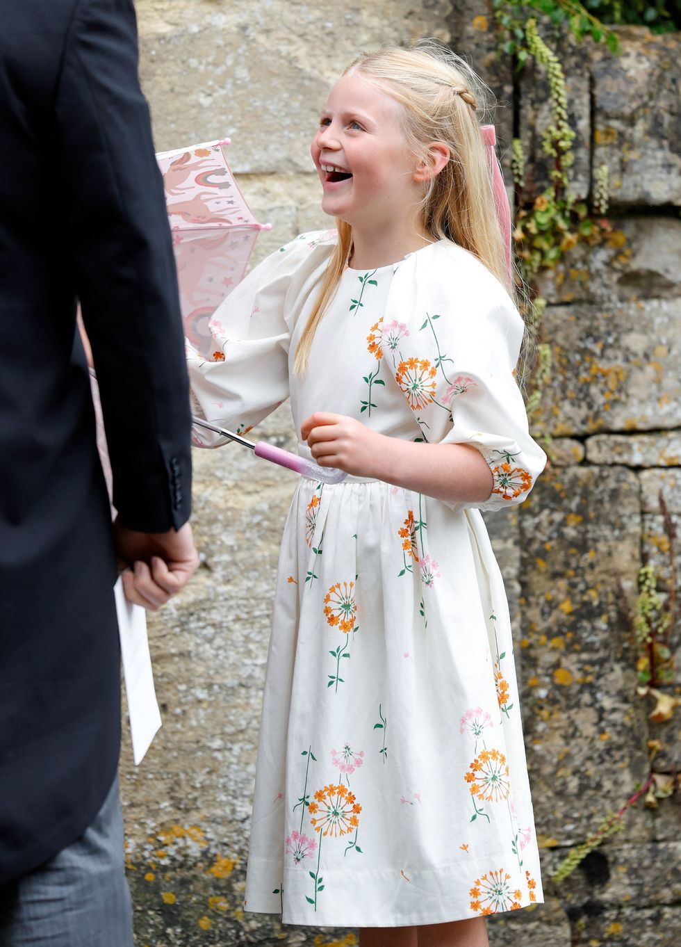 Mia and Lena Tindall steal show at royal wedding as pair shield from ...