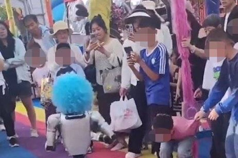 Humanoid clown robot kicks child in stomach during karate display in ...