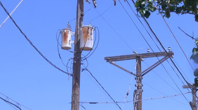 HMP&L removing and replacing power poles and transmission lines