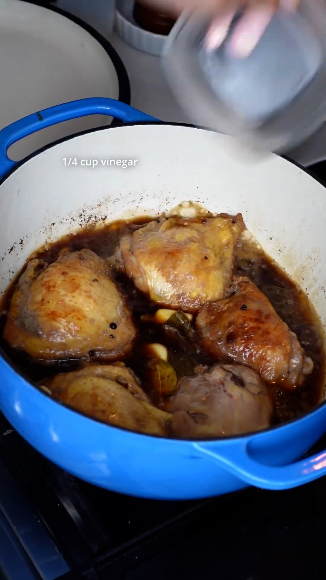Traditional Filipino chicken adobo with soy sauce and vinegar braising