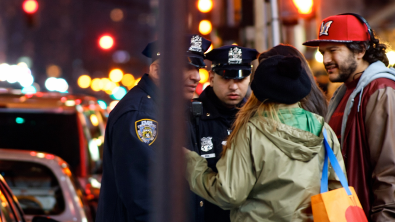 Police officers react after a woman asks for their numbers