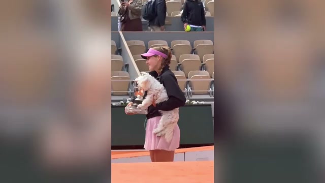 French Open champion Mirra Andreeva celebrates victory with dog