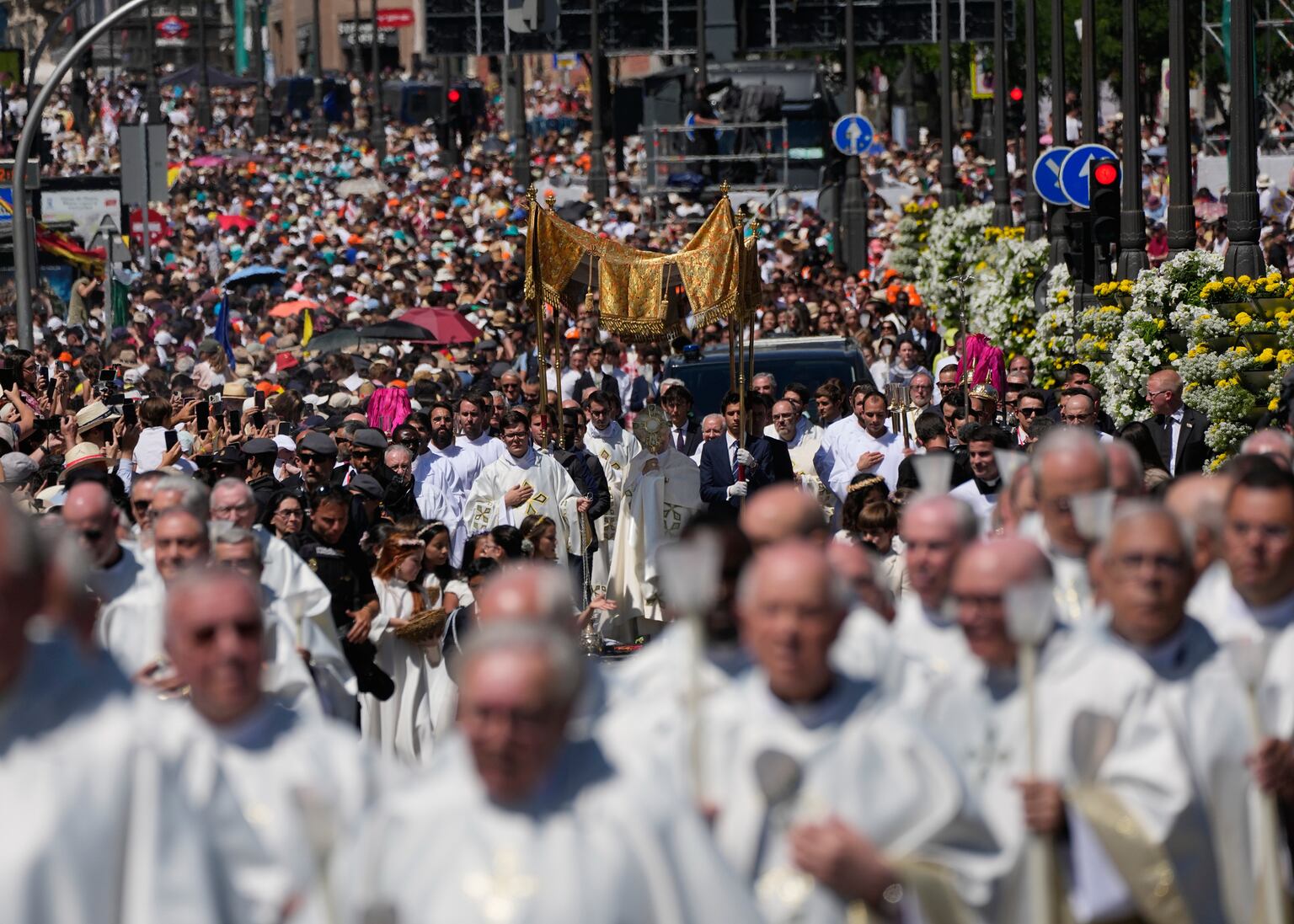 1m flood Madrid’s streets to watch Pope’s procession along flower ...