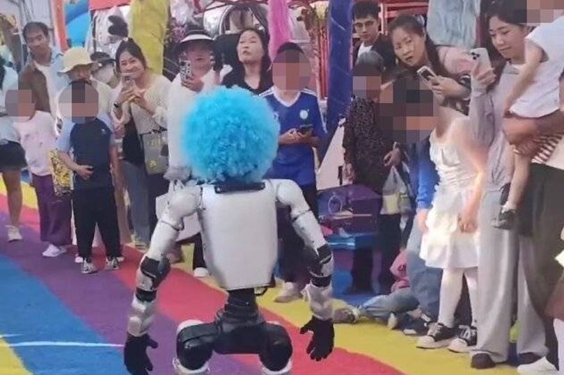 Humanoid clown robot kicks child in stomach during karate display in ...