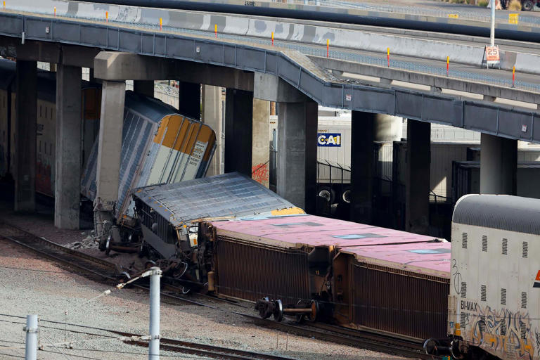 Freight train carrying automobiles derails in downtown near Petco Park