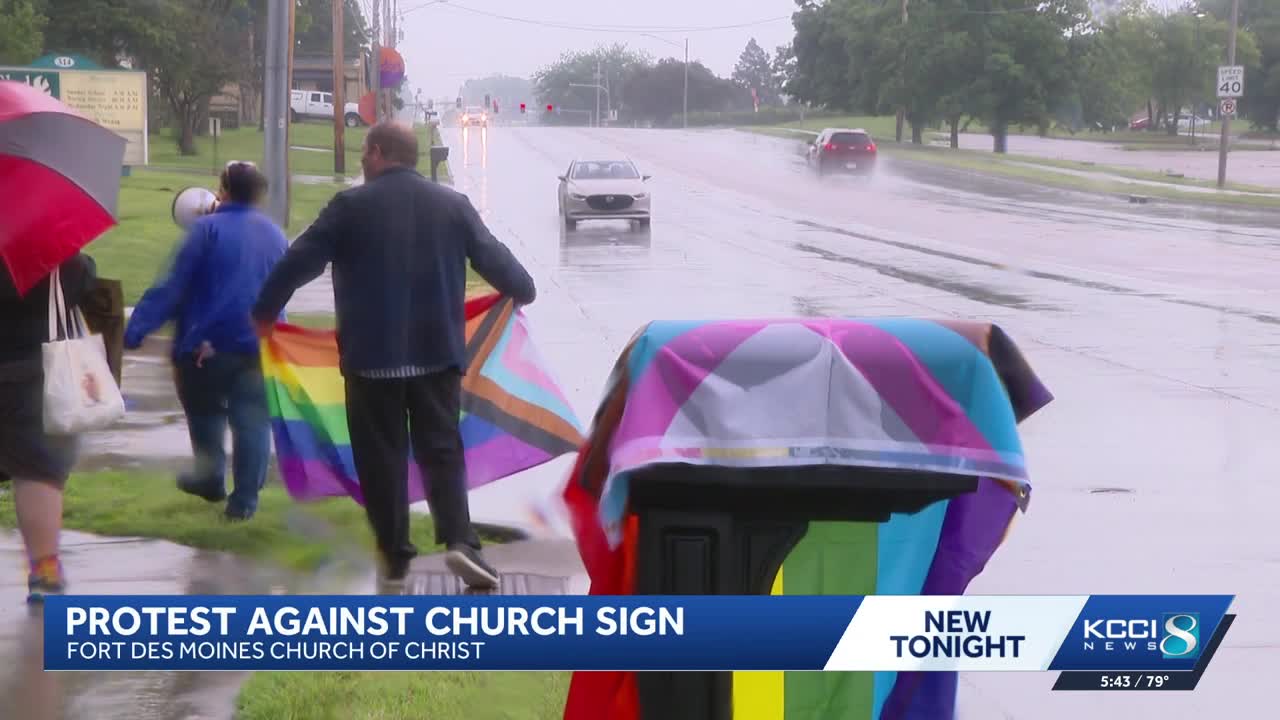 Activists protest church sign in Des Moines during Pride Month