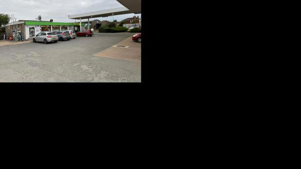 Man confronts shop worker with smashed bottle in alleged petrol station ...