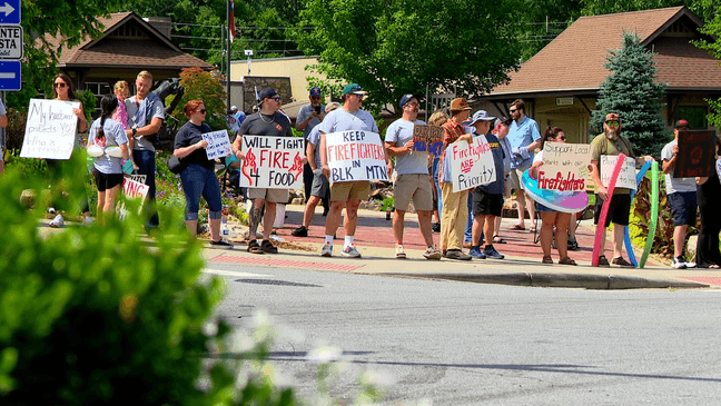 Black Mountain firefighters and families gather to protest low wages ...