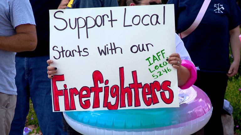 Black Mountain firefighters and families gather to protest low wages ...