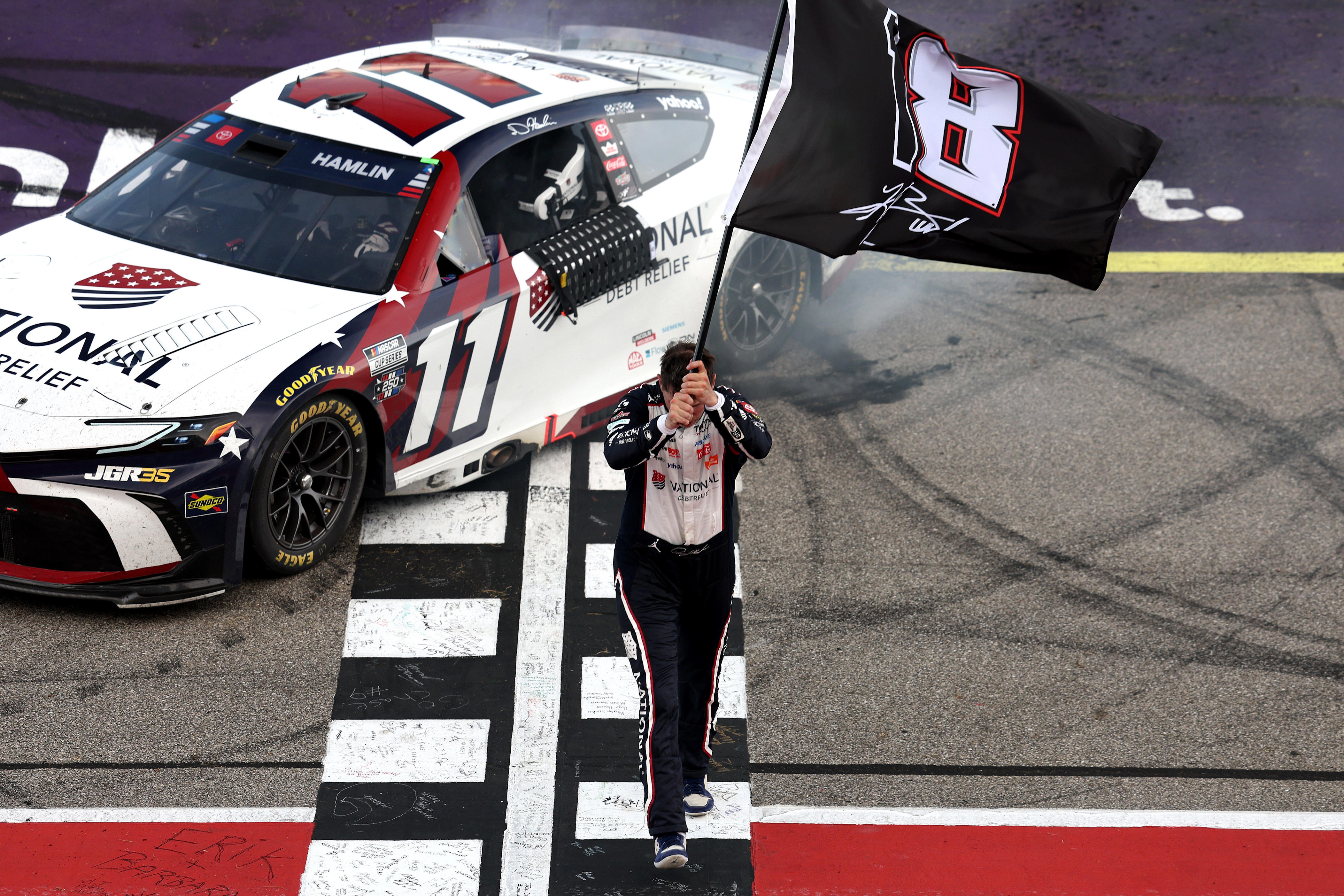 Denny Hamlin explains his Kyle Busch tribute after winning at Michigan