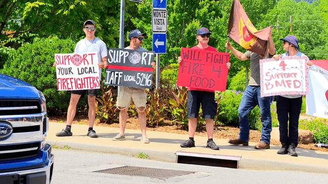 Black Mountain firefighters and families gather to protest low wages ...