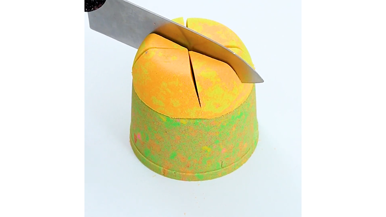 Satisfying cutting orange and green sand dome with knife creating ...