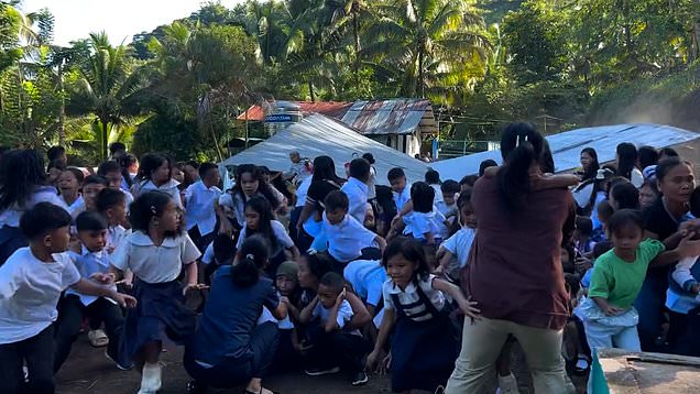 Moment 7.8 magnitude strikes during primary school's outdoors flag assembly