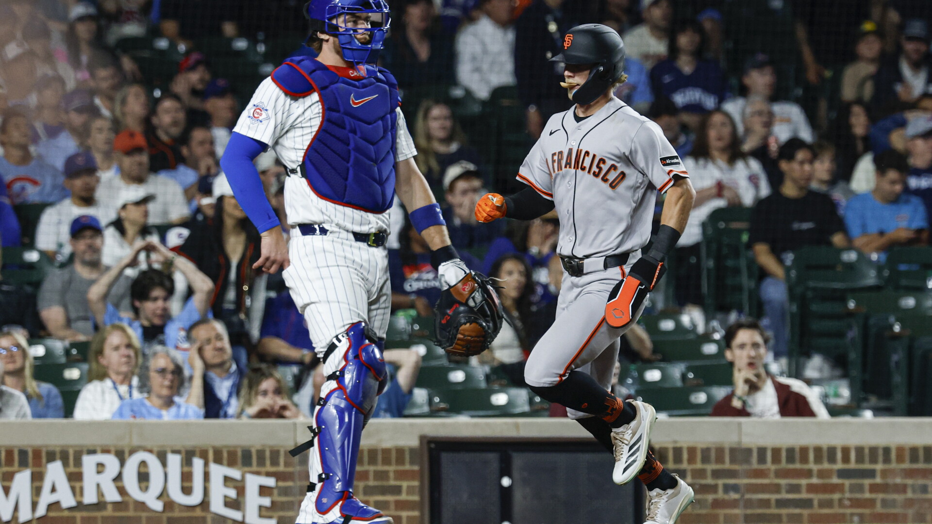 Chapman's 10th-inning single gives the Giants a 2-1 win over the Cubs