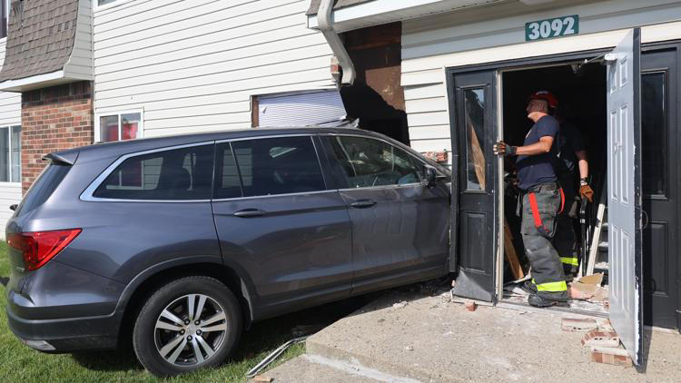 Teenager injured, 2 adults and dog displaced after car crashes into ...