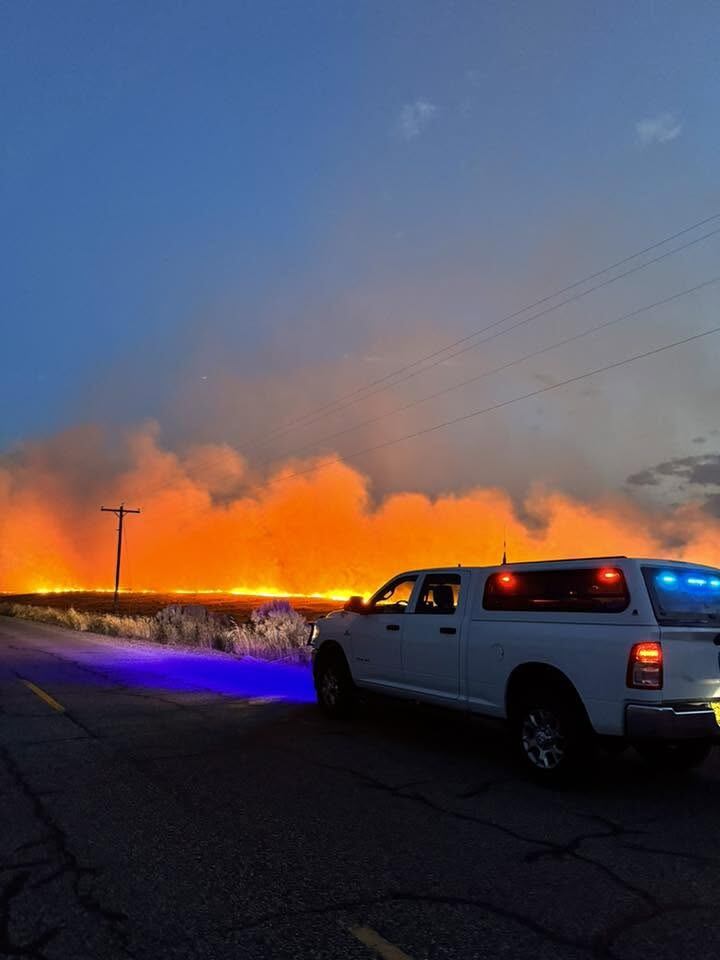 Evacuation levels lowered as crews continue containment operations on ...