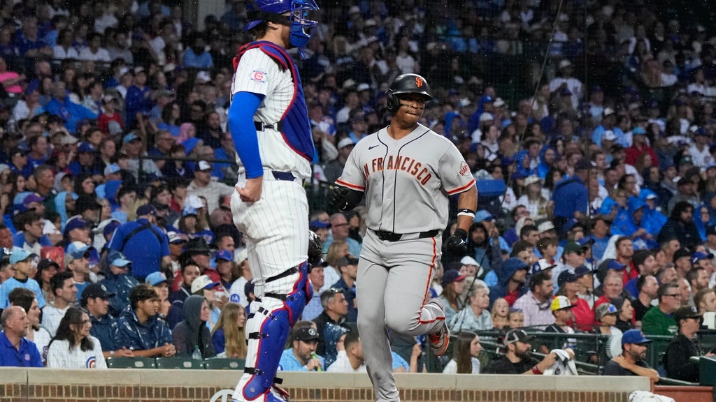 Chapman's 10th-inning single gives the Giants a 2-1 win over the Cubs