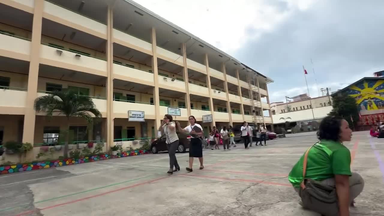 Teachers and pupils rush to open space as ground shakes during earthquake
