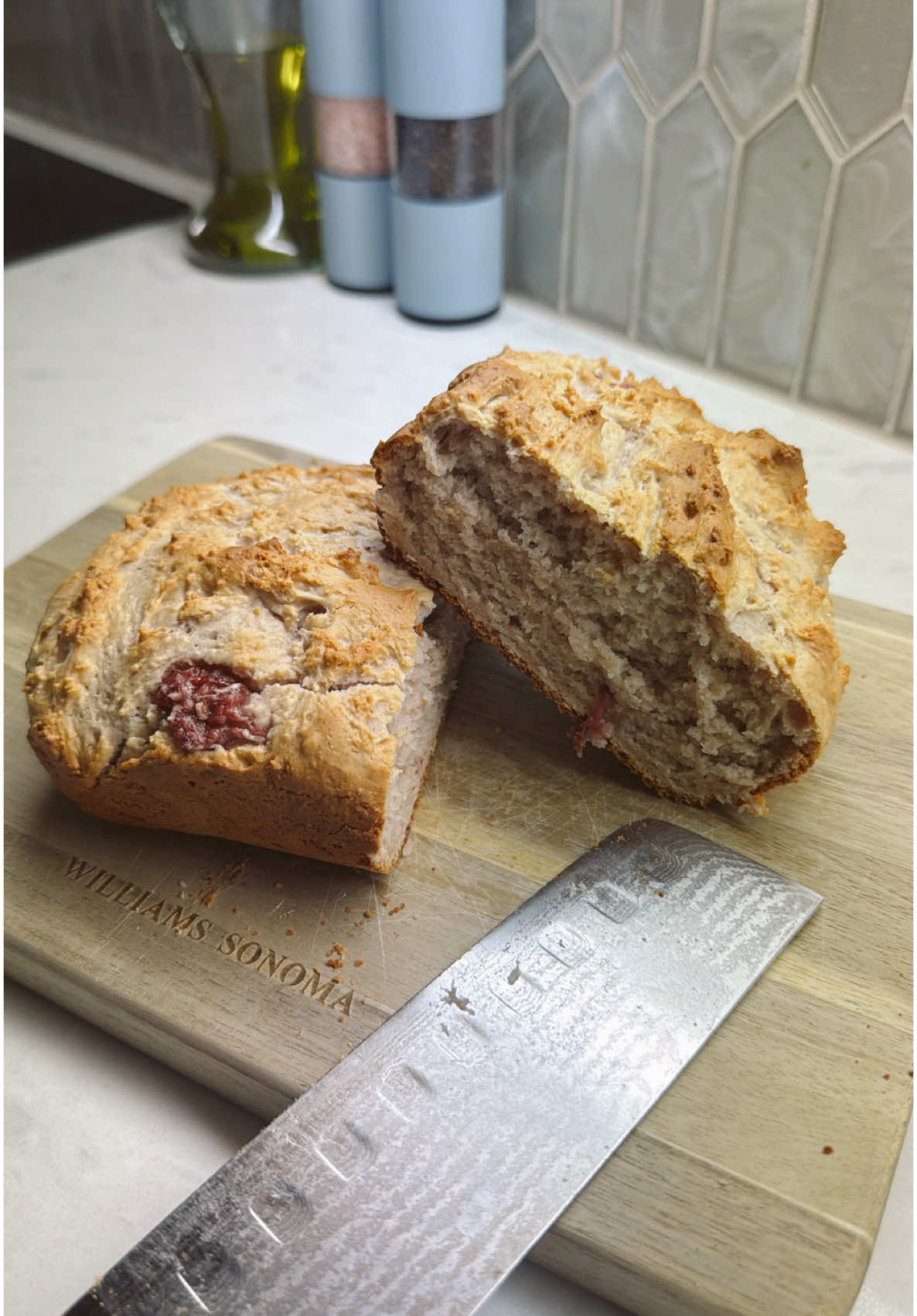Freshly baked homemade bread with sweet red fruit, sliced on my ...