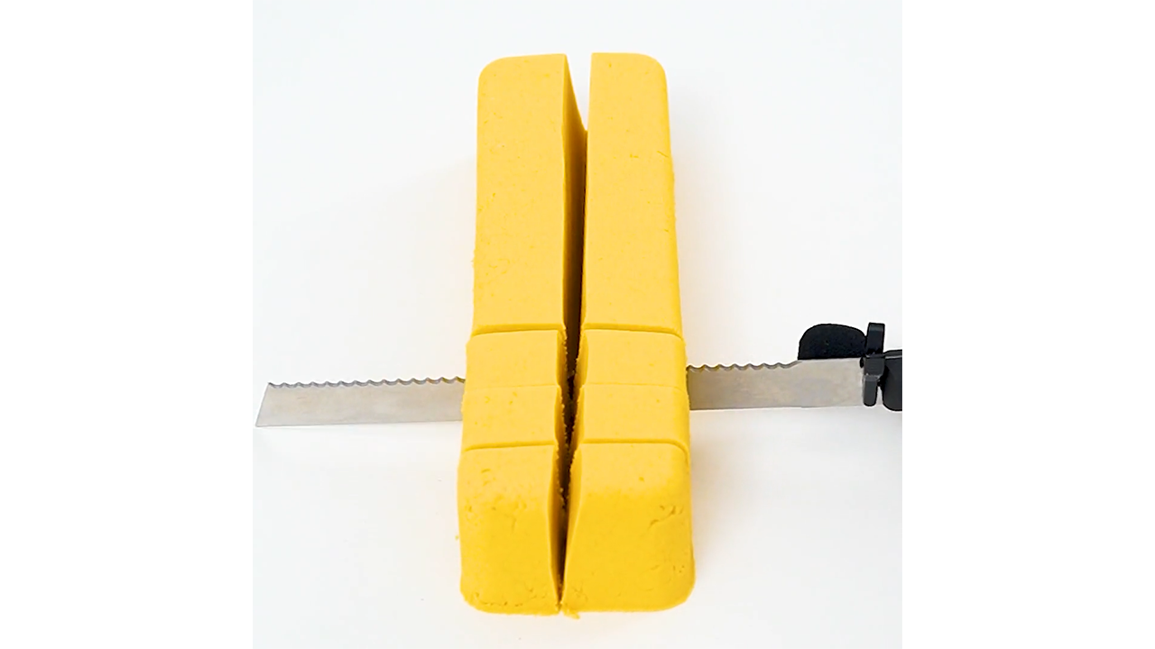 Satisfying Slicing Yellow Sand Bars With Serrated Knife Creating ...