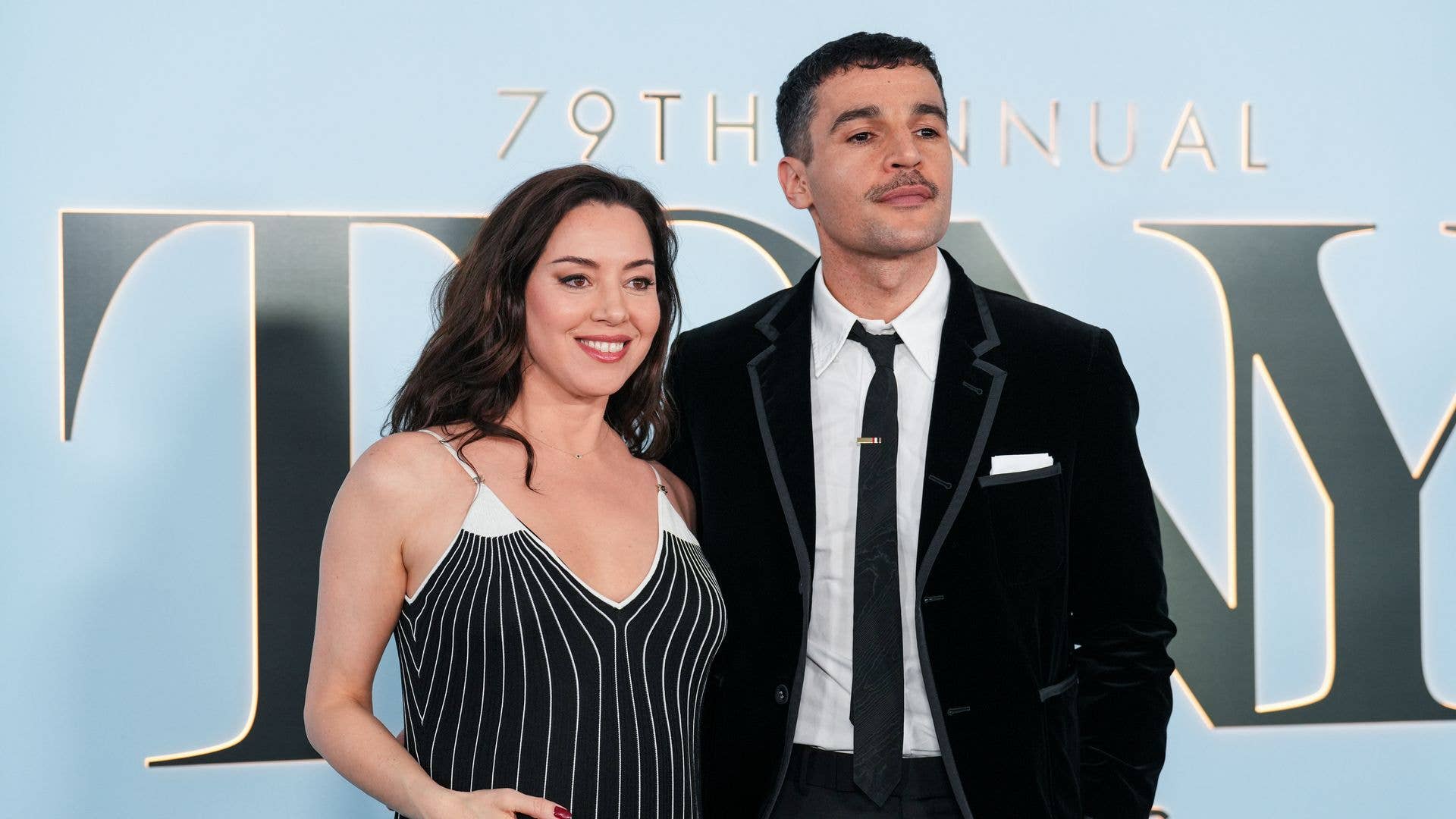 Aubrey Plaza showcases her growing baby bump in loved-up red carpet ...