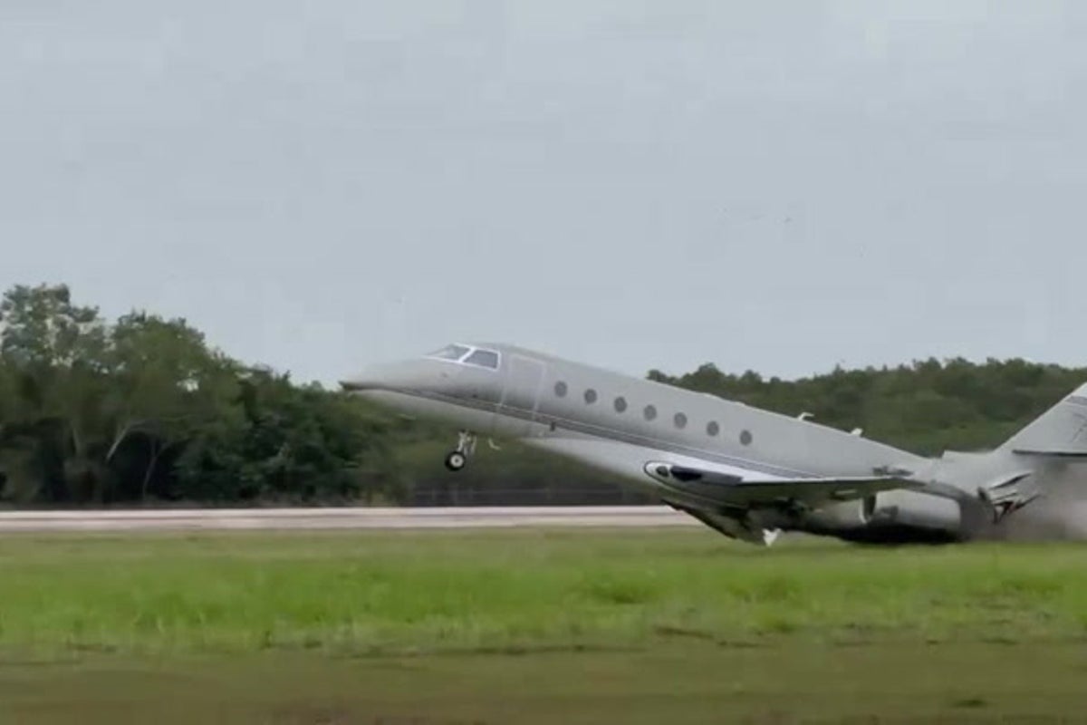 Private jet crashes on runway during emergency landing at airport