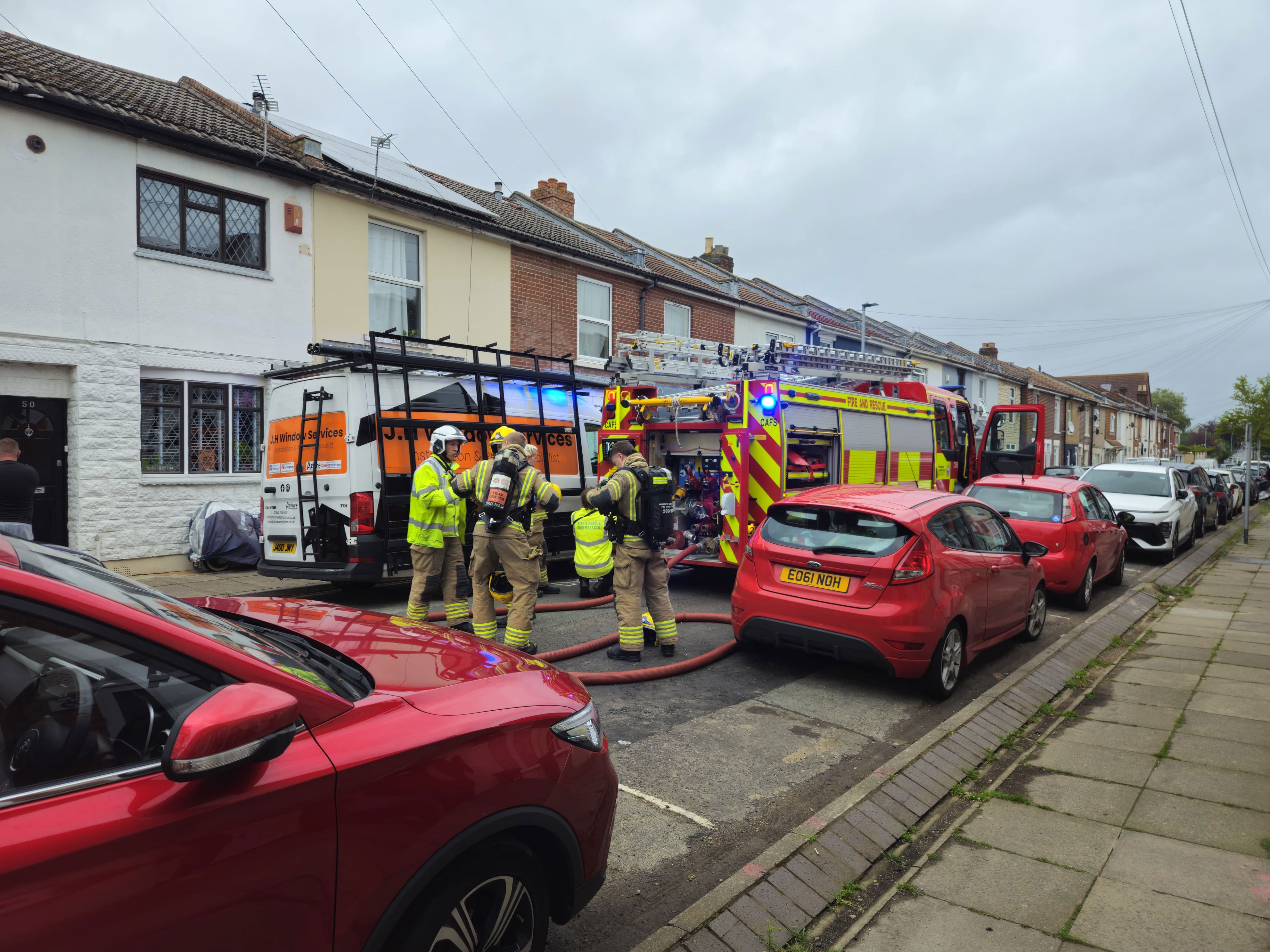 WATCH: Fire crews deal with shed blaze which spread to neighbours fence ...