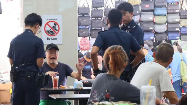 Man and woman shared a table at a hawker centre and threw hot porridge ...
