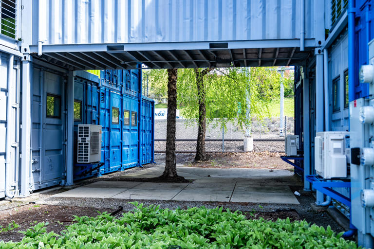 Why shipping containers are stacked off Route 6/10 and what they are