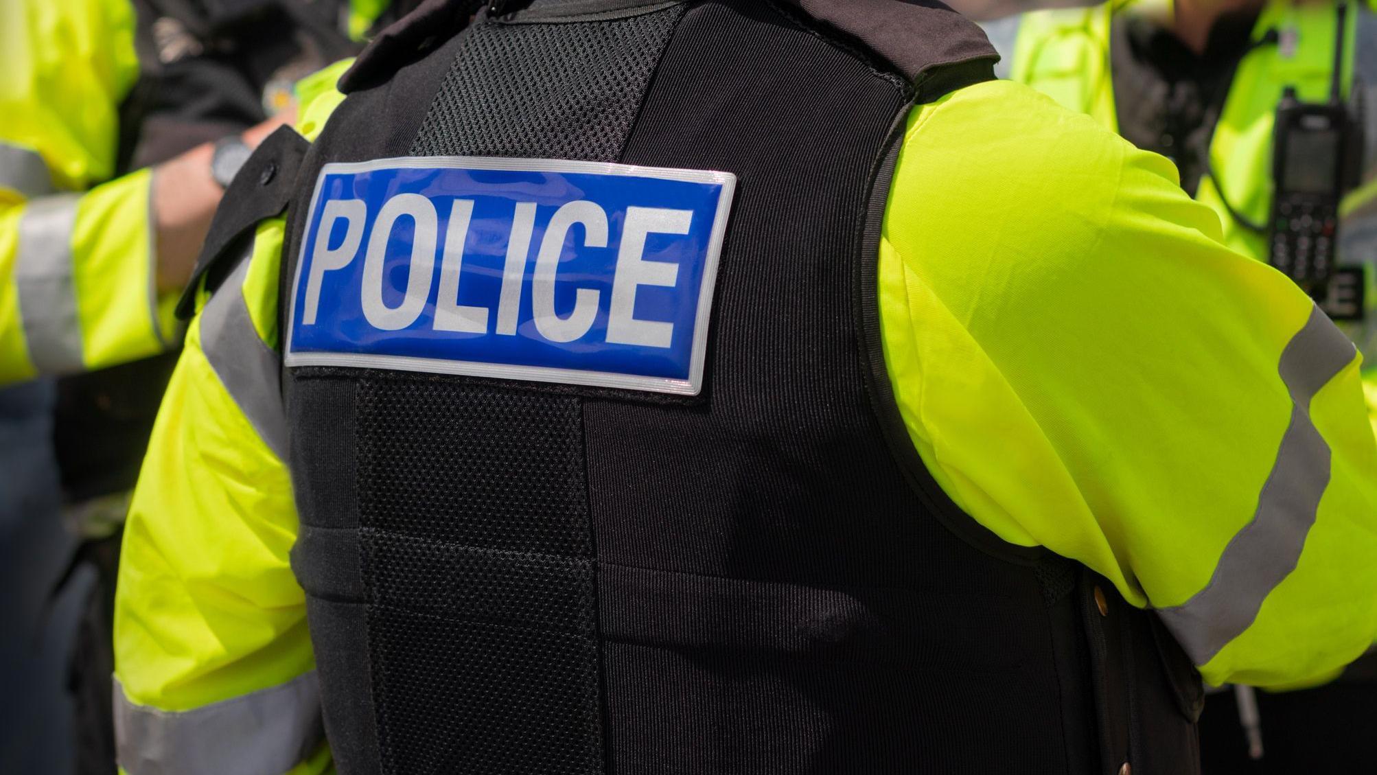 Man charged after taxi driver racially abused