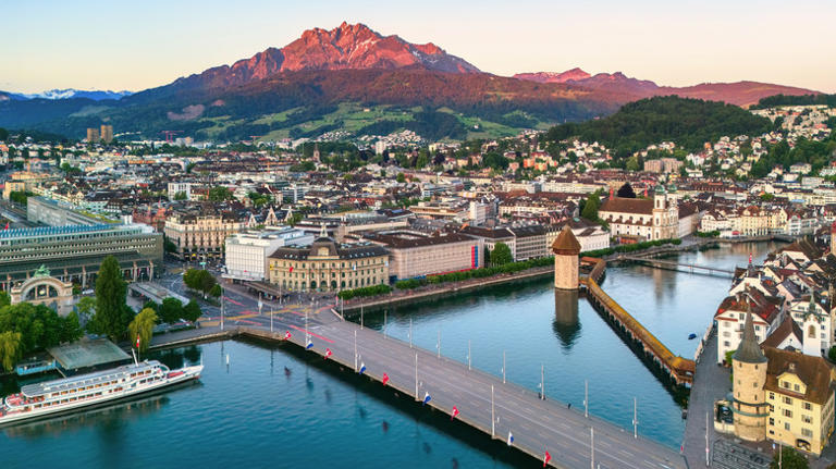 Switzerland's most scenic train journey traverses snow-capped peaks and ...