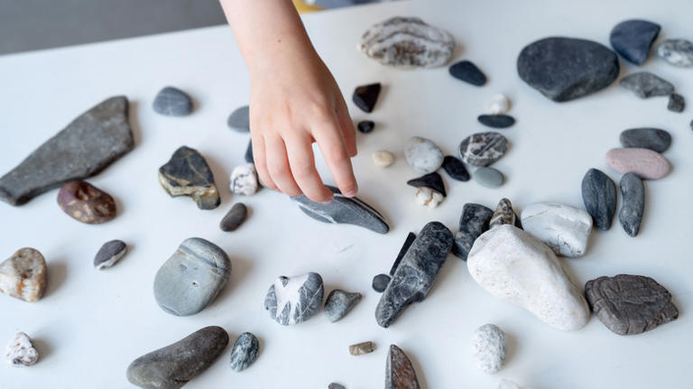 Use simple stones to create budget-friendly pavers with this unique DIY