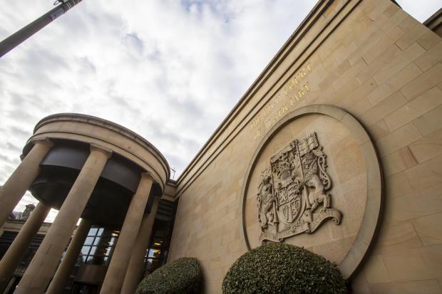 Glasgow crime gang member caught by bathroom floor picture