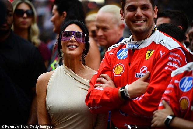 Lewis Hamilton sprays Kim Kardashian with champagne and blows a kiss
