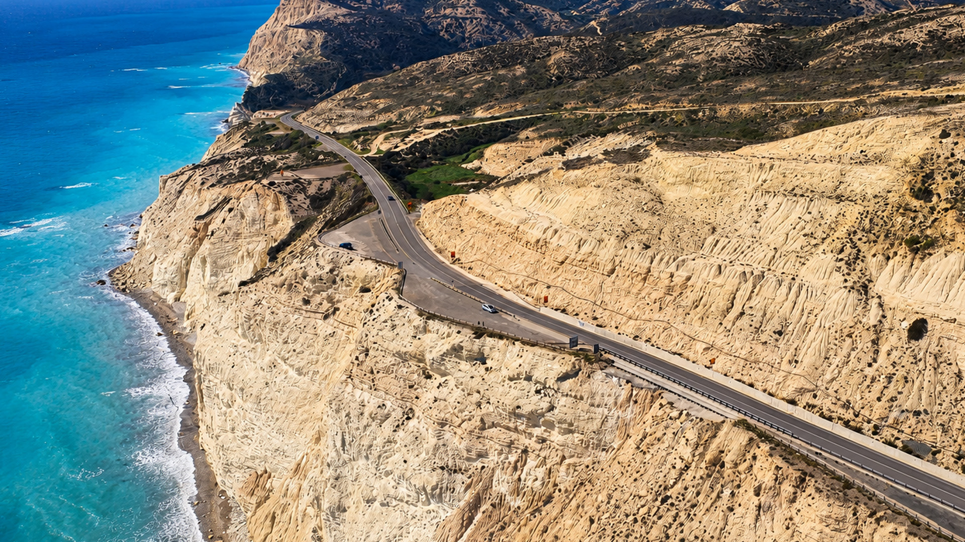 Why was this road built along crumbling cliffs?