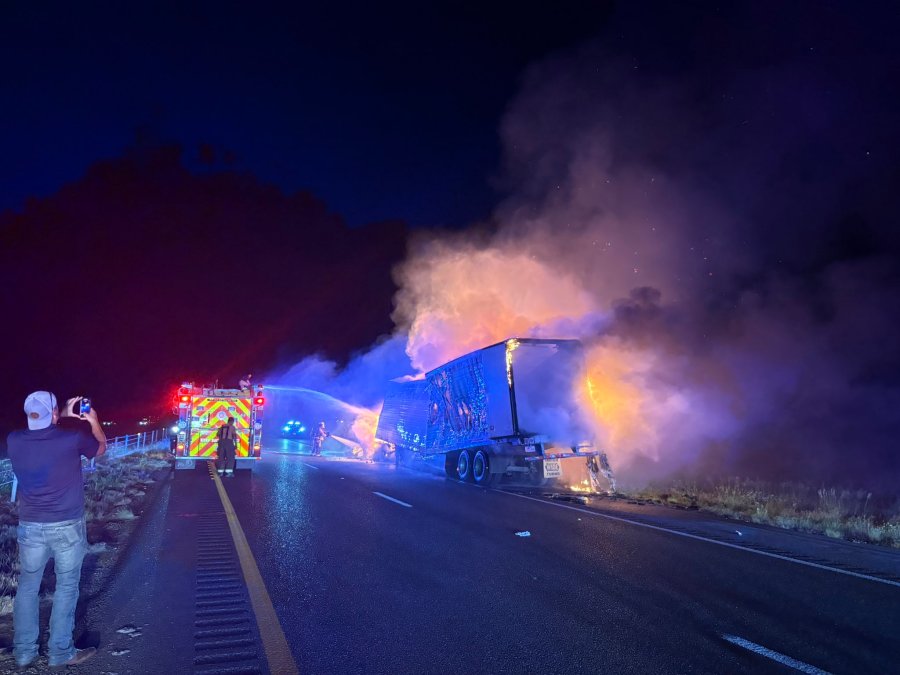 2 charged after trailer with 39 migrants inside catches fire