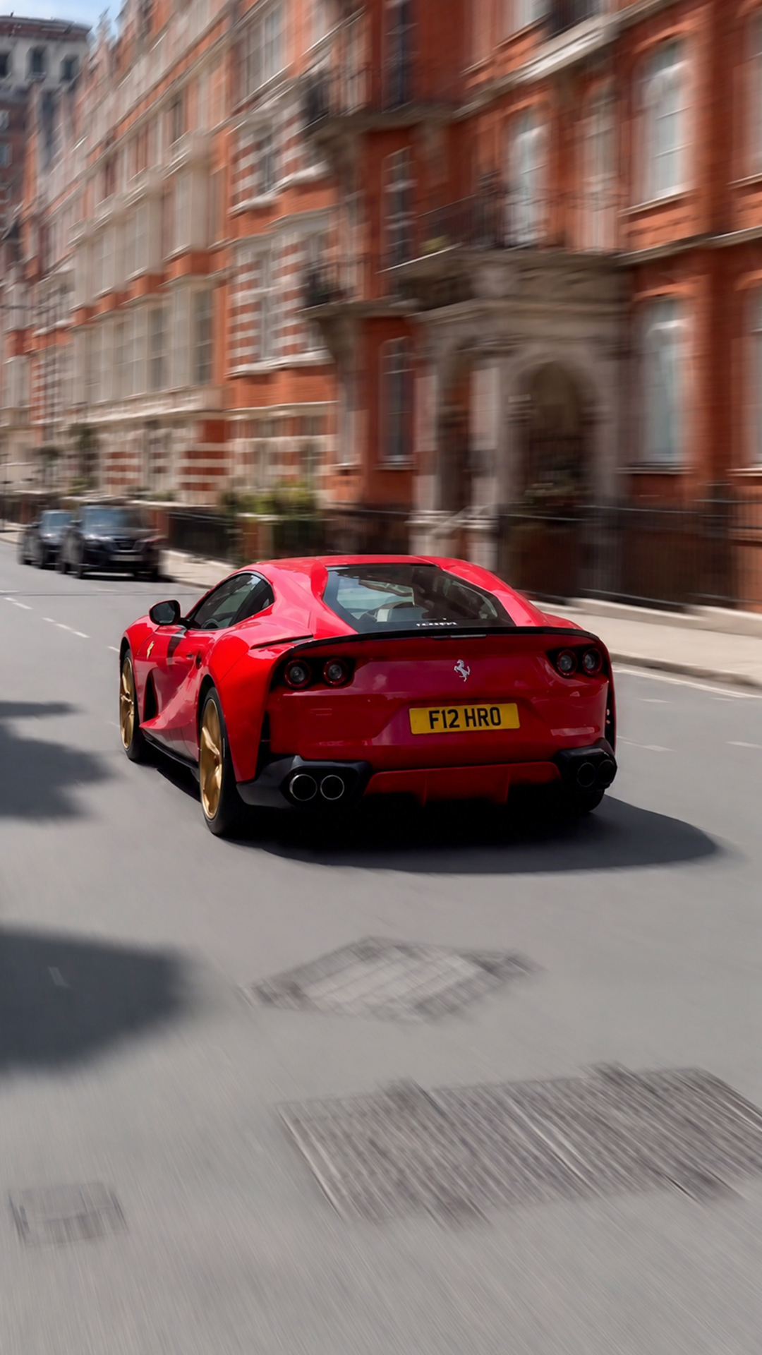 Ferrari 812 Superfast moving swiftly through the city