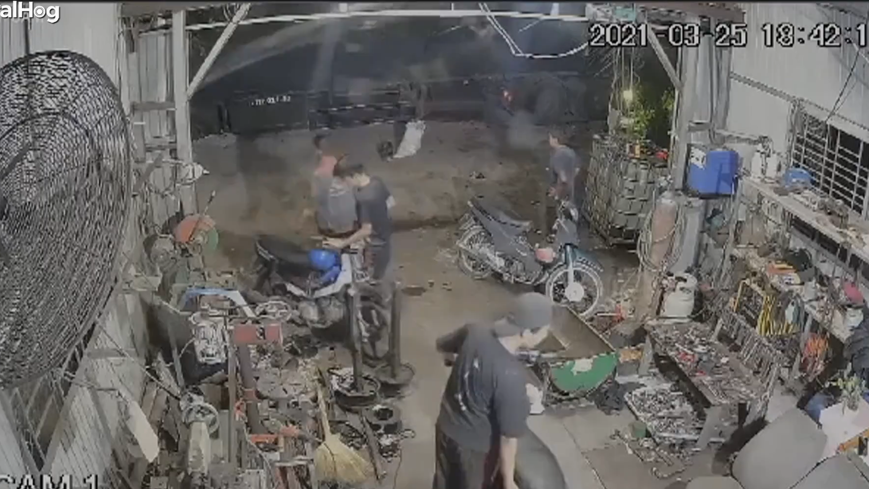 Truck tips rice all over auto repair shop
