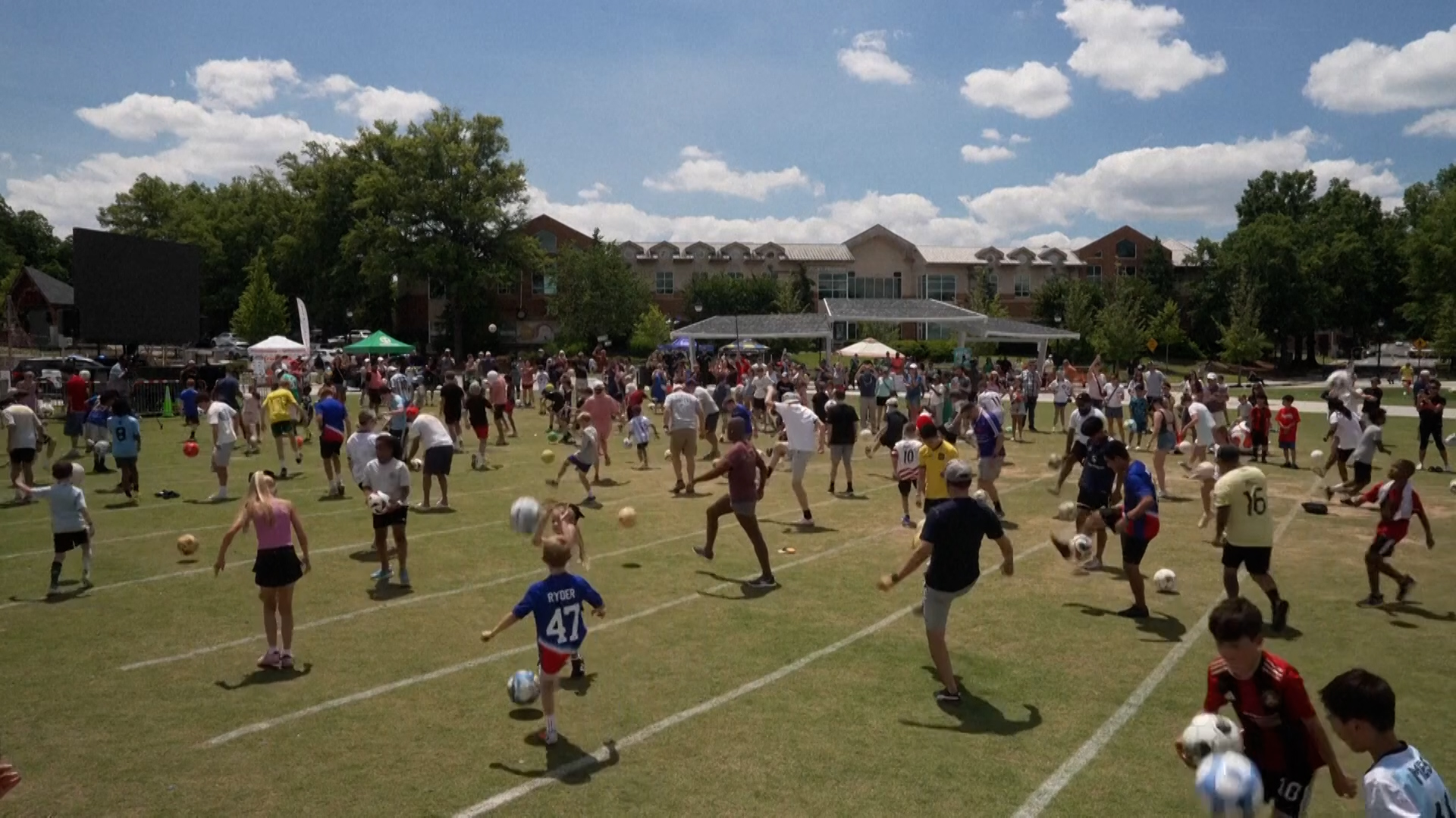Football fans attempt world record for most people juggling football