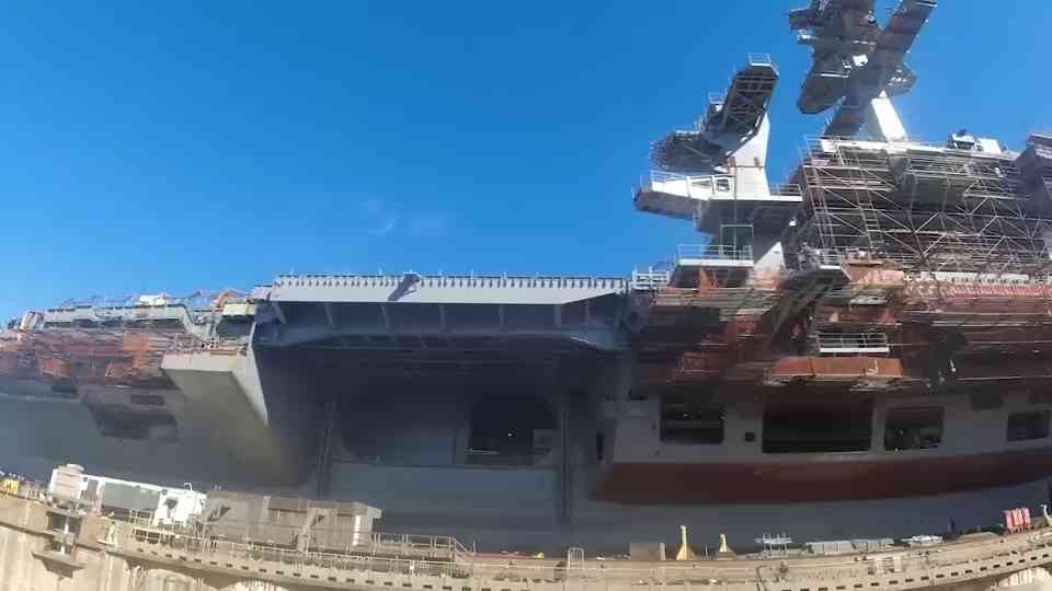 The terrifying moment a brand new warship touches water