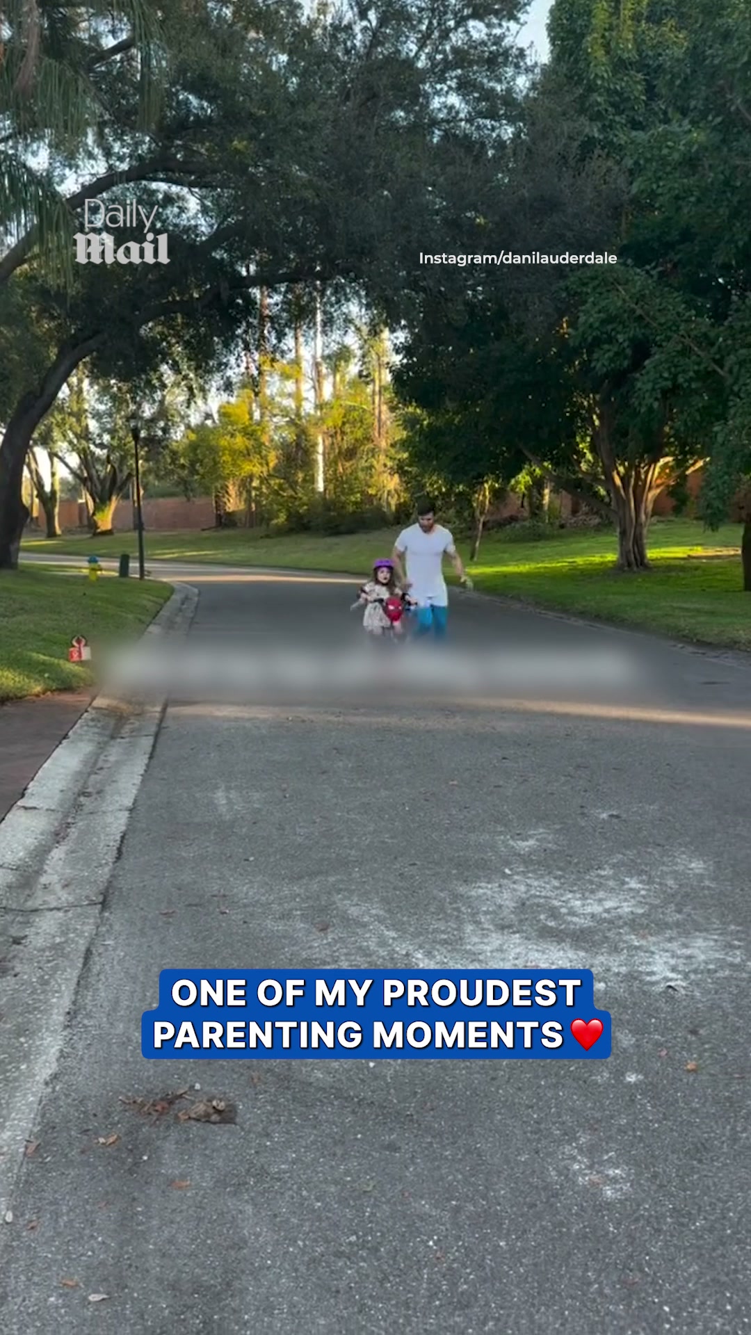 Dad celebrates milestone as daughter learns to ride a bike