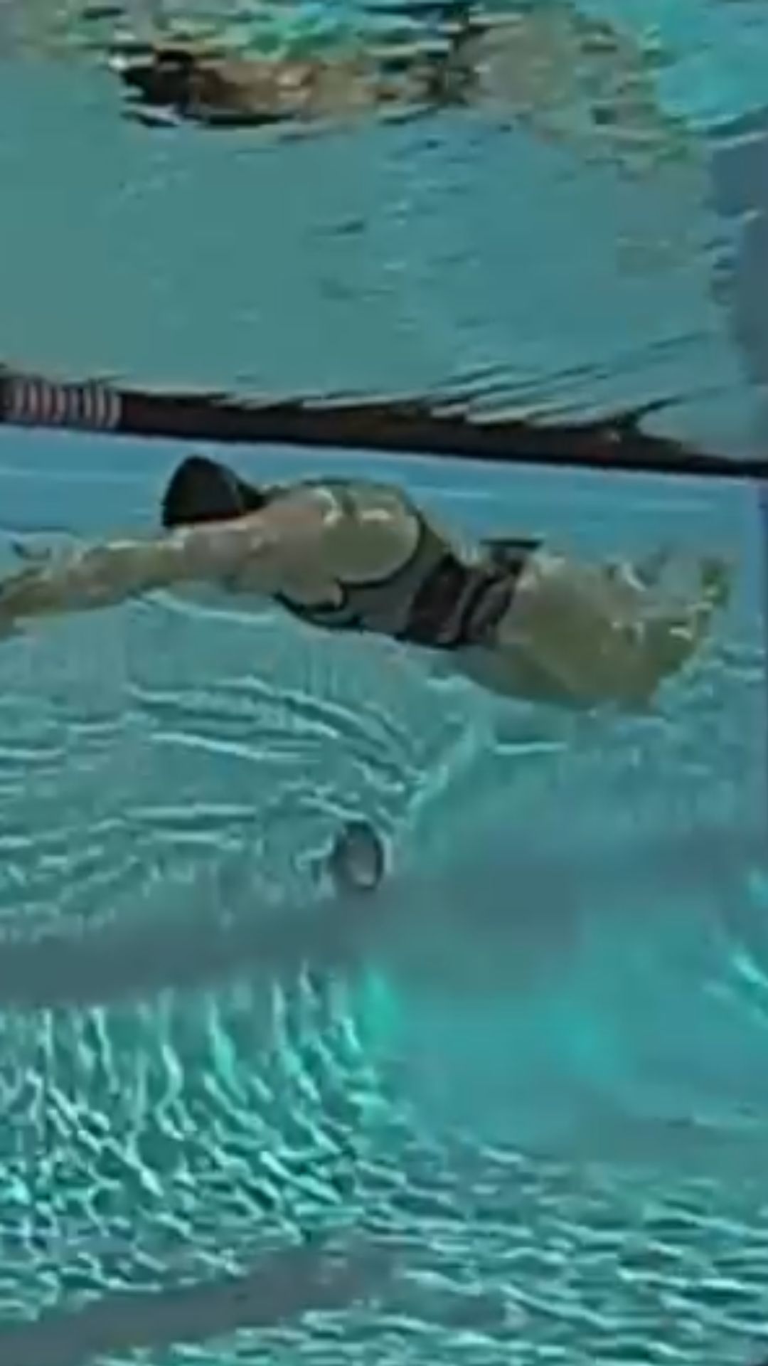A close look at underwater dolphin style swimming