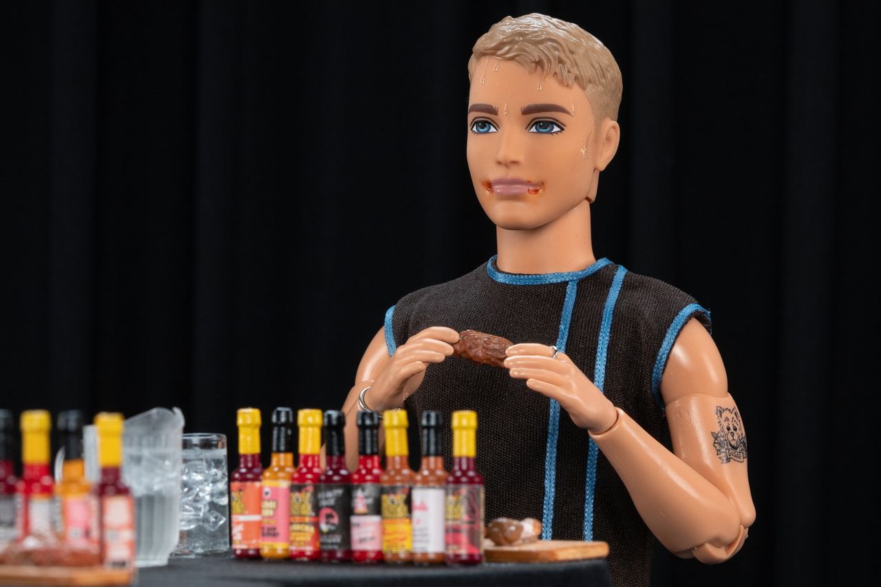 Mattel's Ken reveals secret tattoo while eating hot wings with Sean ...