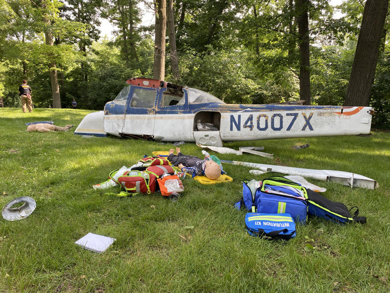 Emergency crews practicing plane crash response with simulation on ...