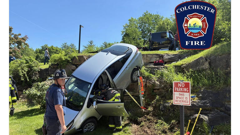 Car drives over edge of small cliff in Colchester parking lot